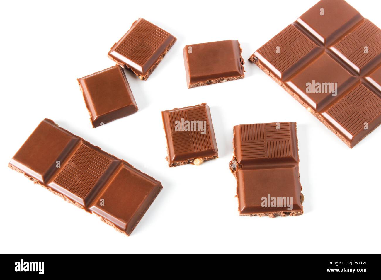 Chocolate bar broken into slices isolated on white Stock Photo - Alamy