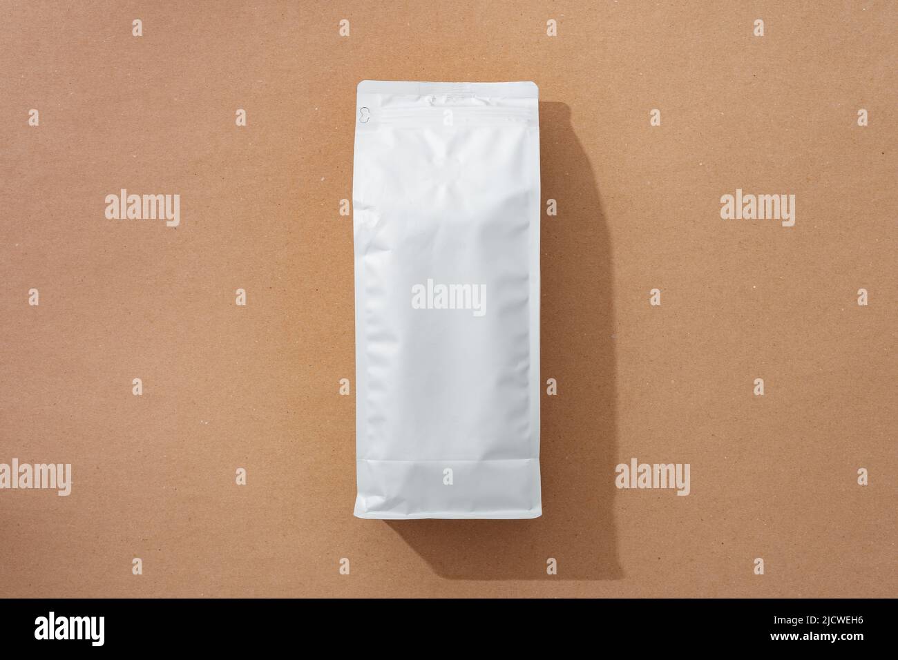 White blank matte coffee package on paper background Stock Photo - Alamy