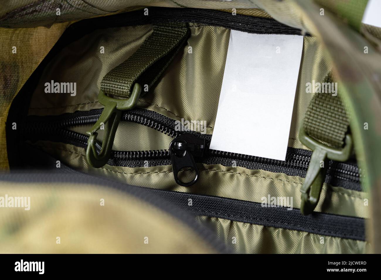 Open military backpack of khaki color on a white background Stock Photo ...