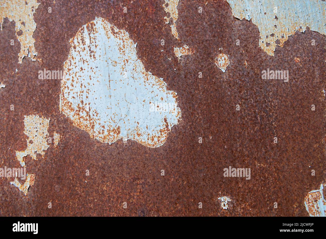 Rusty surface with old paint residue. Rusty metal surface as background ...