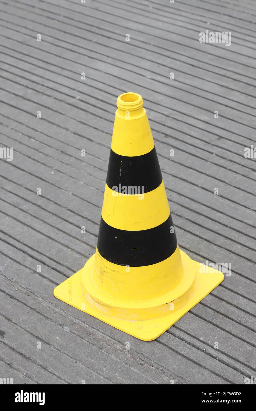 Black yellow traffic cone sign hi-res stock photography and images - Alamy