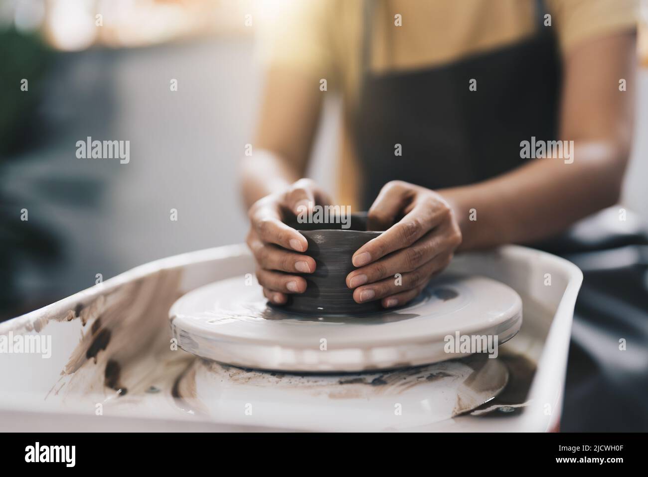 Pottery wheel hands hi-res stock photography and images - Alamy