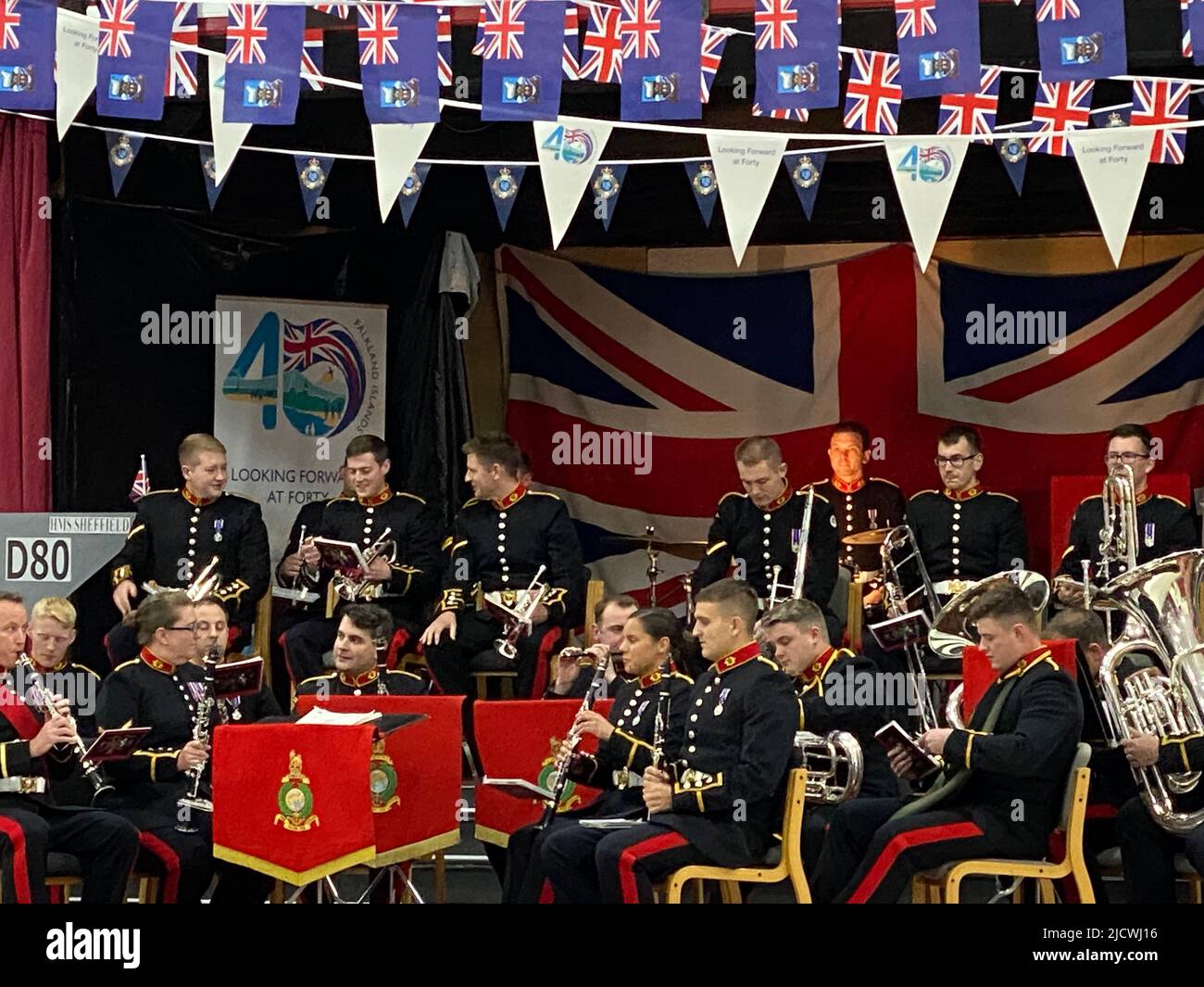 Stanley, UK. 15th June, 2022. A British military band plays in the town ...