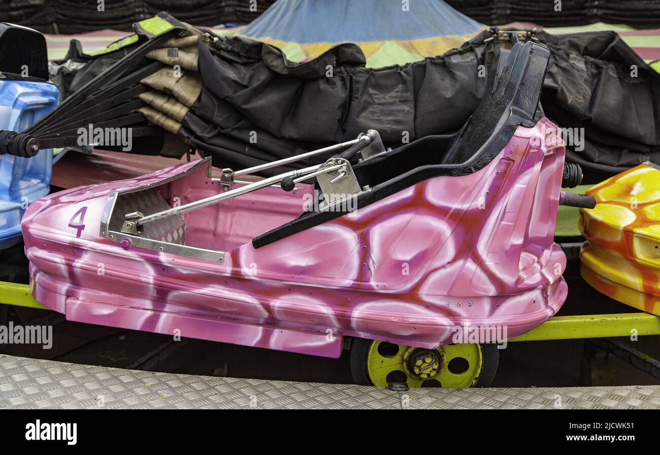 Detail of seats of a fair, fun and party attraction Stock Photo - Alamy