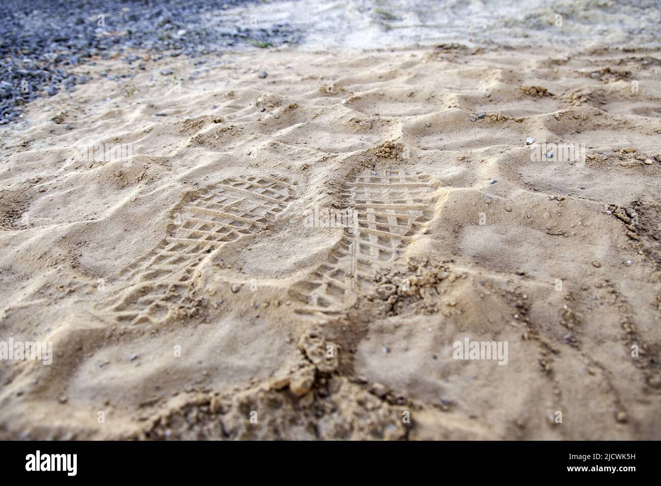 Shoe sole mark detail in the sand Stock Photo - Alamy