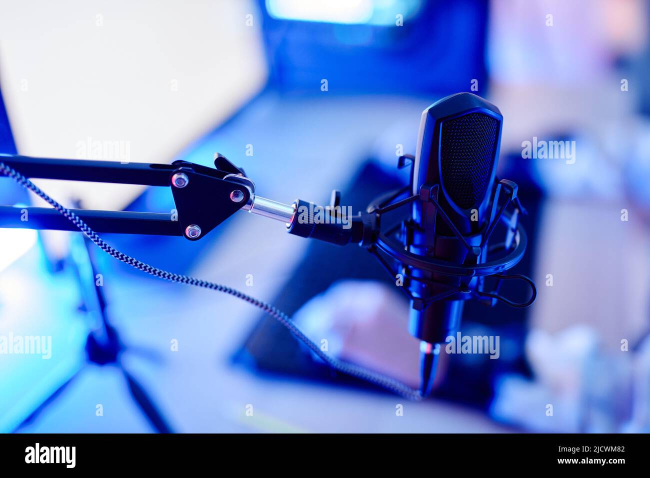 Close up of professional microphone on stand in video game streaming ...