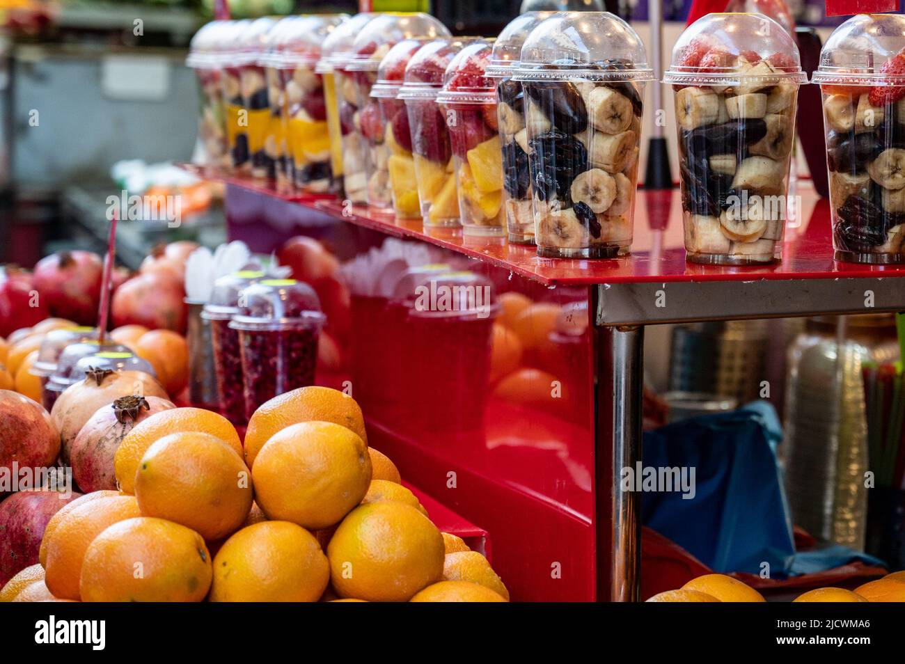 Fruits are harvested and stacked on the counter in the market for ...