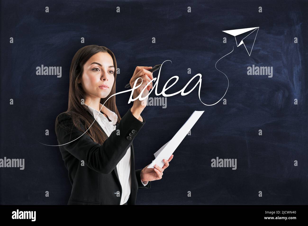Creative idea and strategy concept with young woman on blackboard ...