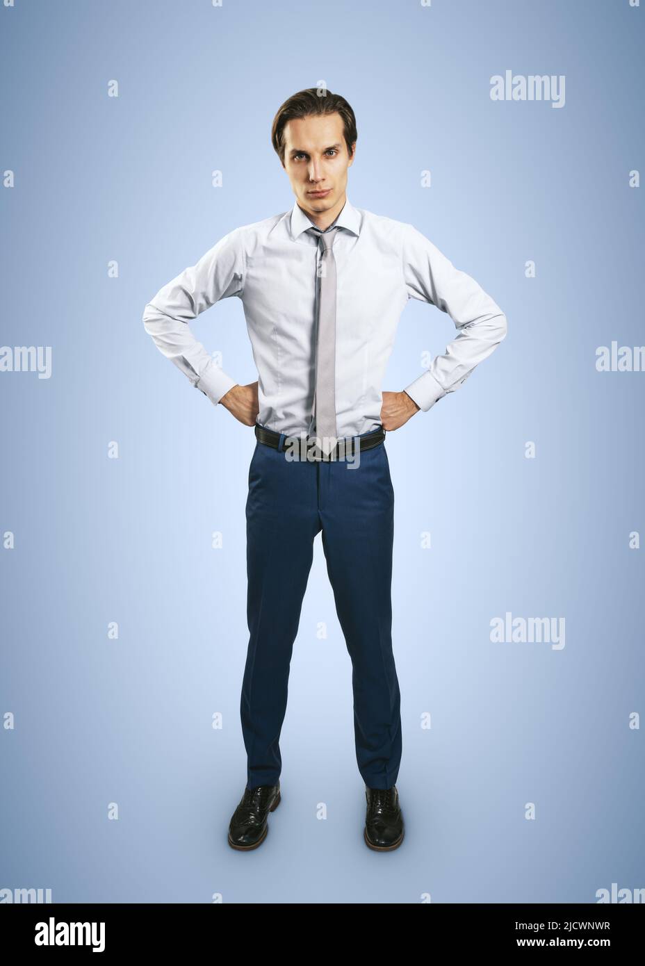 Strength concept with confident young man looking at you isolated on ...