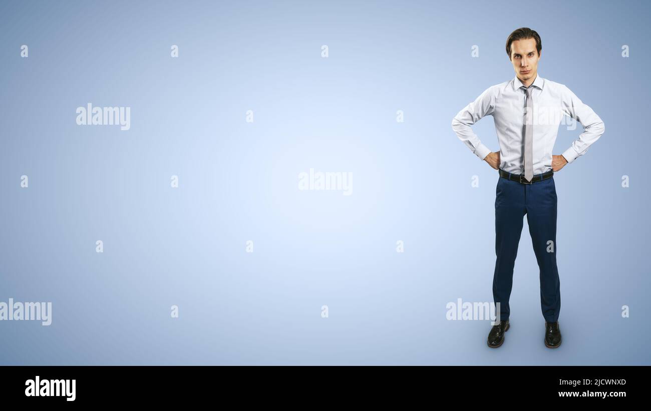 Strength and confidence concept young smart guy on blank light blue ...