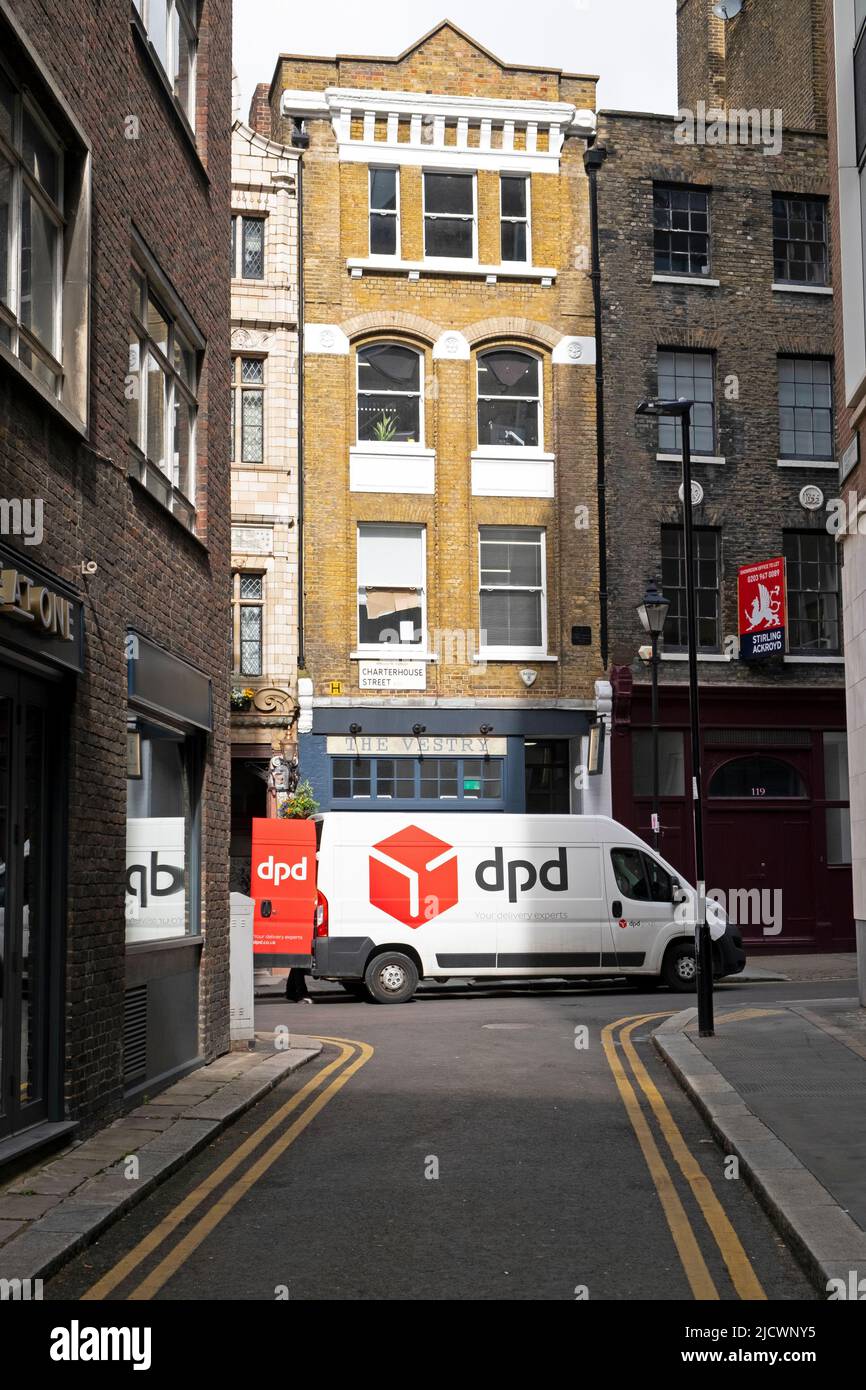 View of buildings and dpd van delivering parcels in a street in ...
