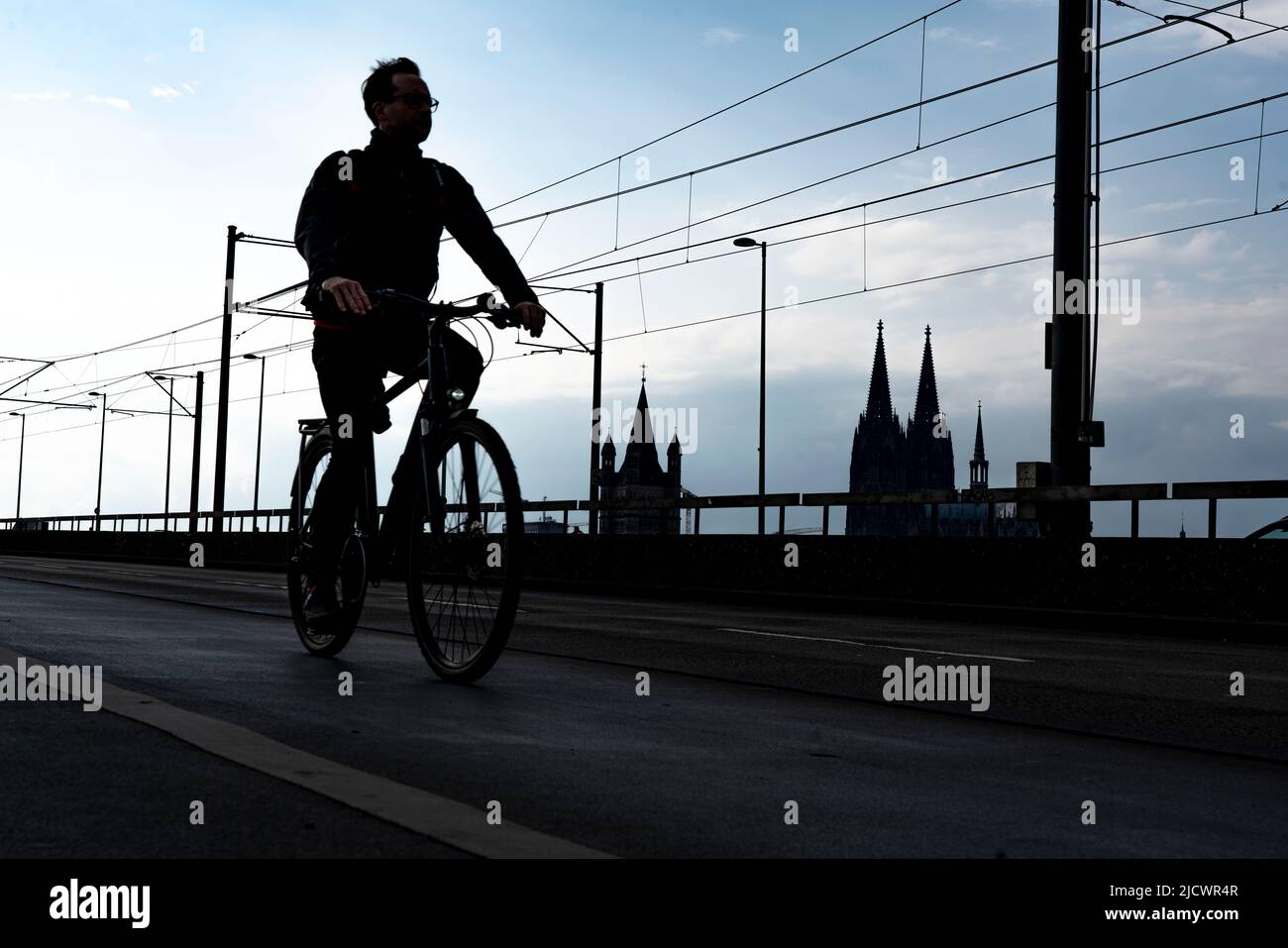 Cycling in the big city, cyclists on the Deutzer Bridge in Cologne ...