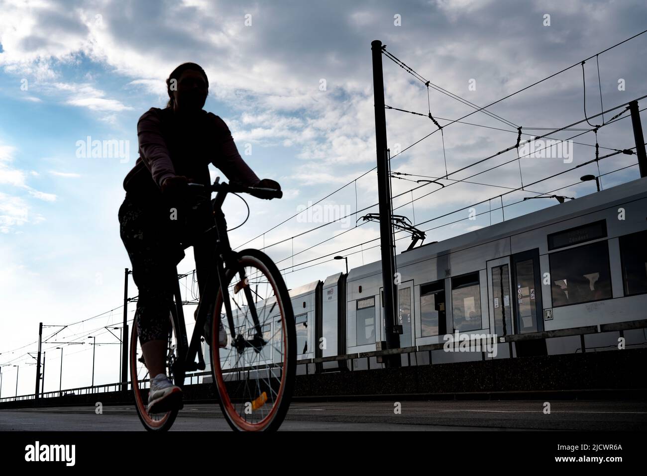 Cycling in the big city, cyclists on the Deutzer Bridge in Cologne ...