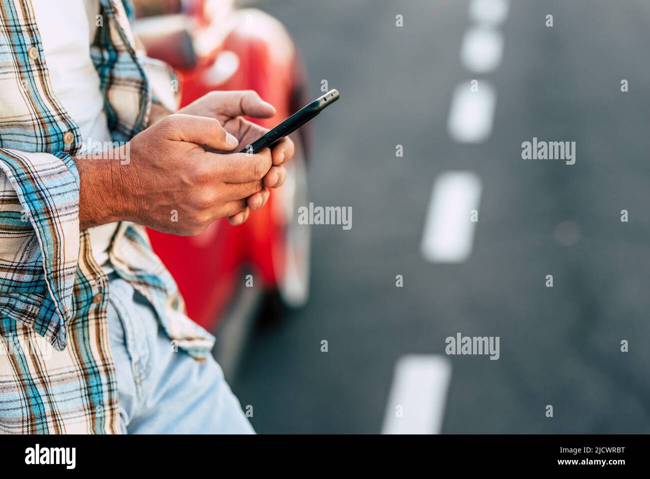 Hands using mobile on map hi-res stock photography and images - Alamy
