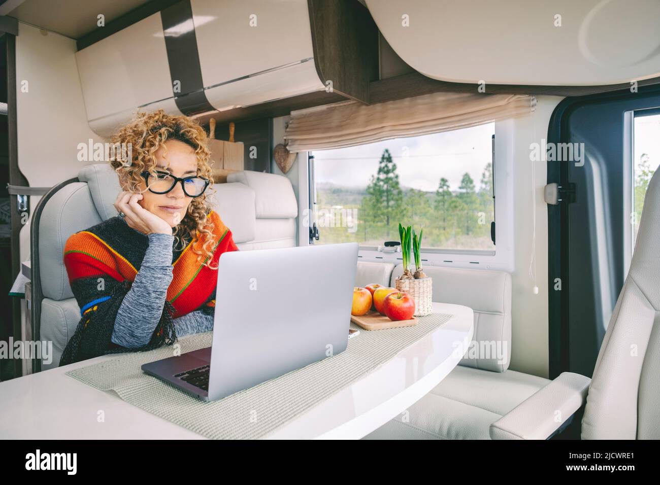 Off grid van life and digital nomad lifestyle. Cute modern woman ...