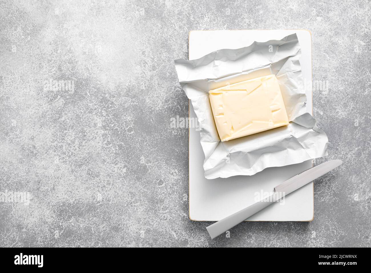 Block of butter with butter knife in a open pack Stock Photo - Alamy