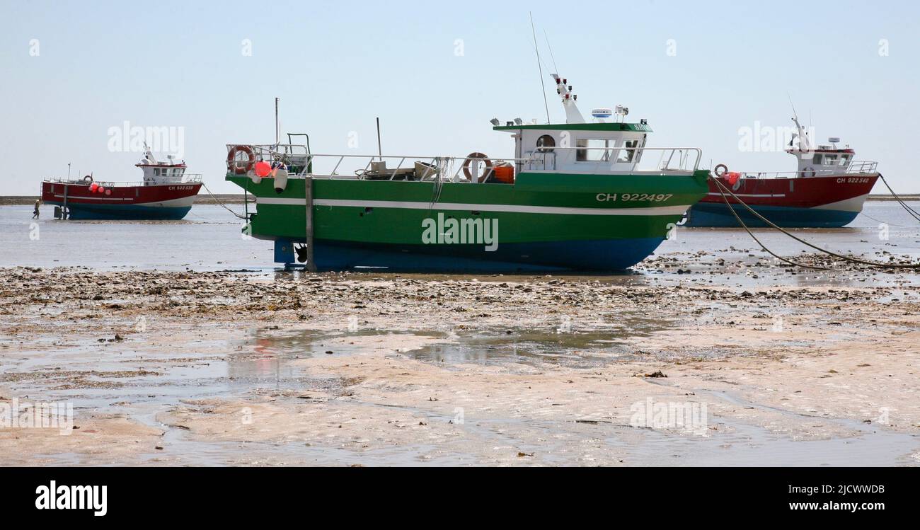Fishing boats at Pirou Plage in Normandy, France, waiting for the tide ...