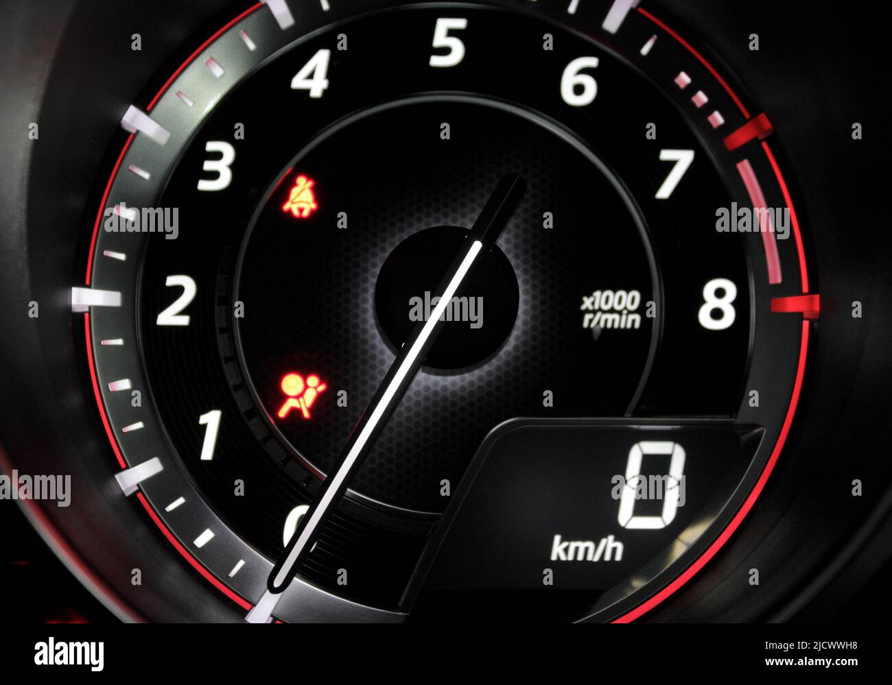Close up glowing tachometer needle on zero engine speed on the car ...