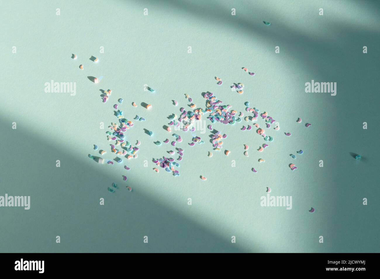 Microplastic on a blue background with a space for copying. A hard ...