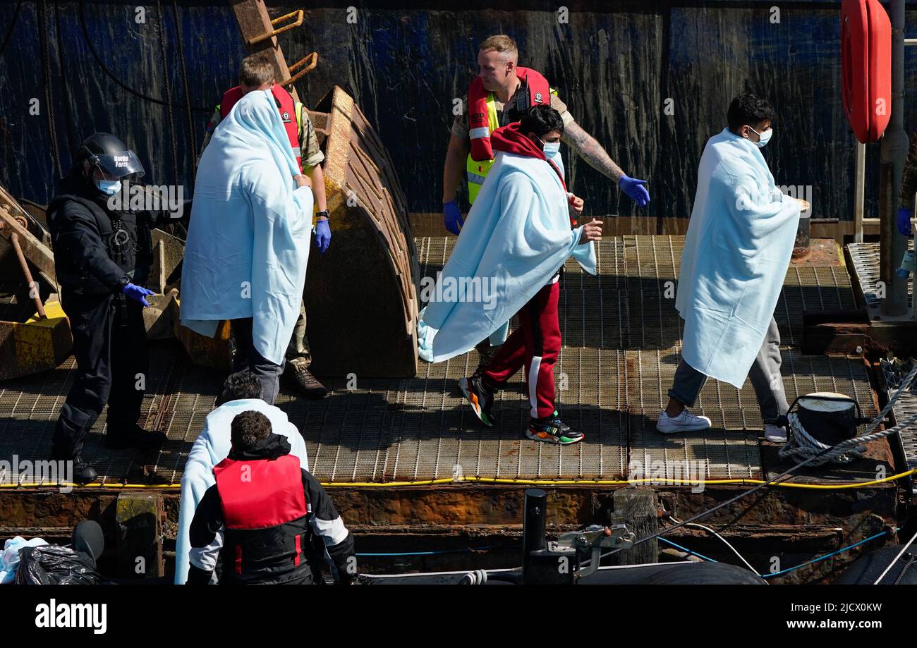 A group of people thought to be migrants are brought in to Dover, Kent ...