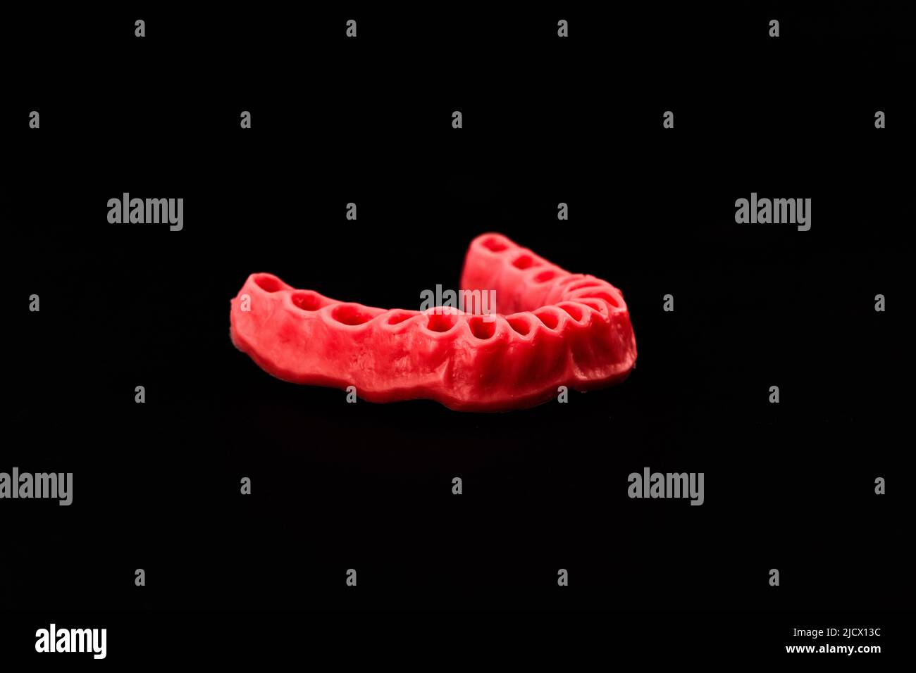 human gums without teeth model medical implant isolated on black ...