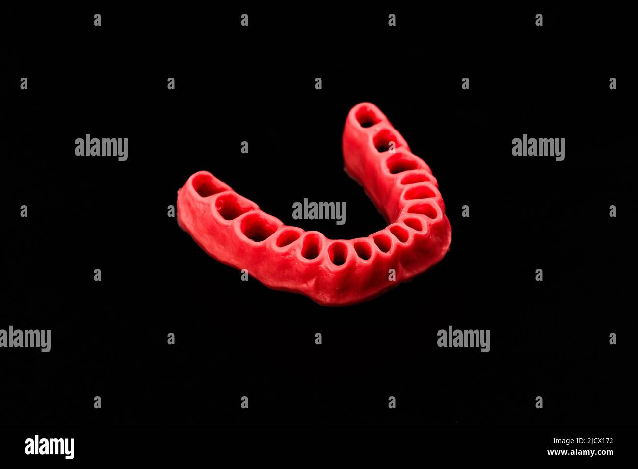 human gums without teeth model medical implant isolated on black ...