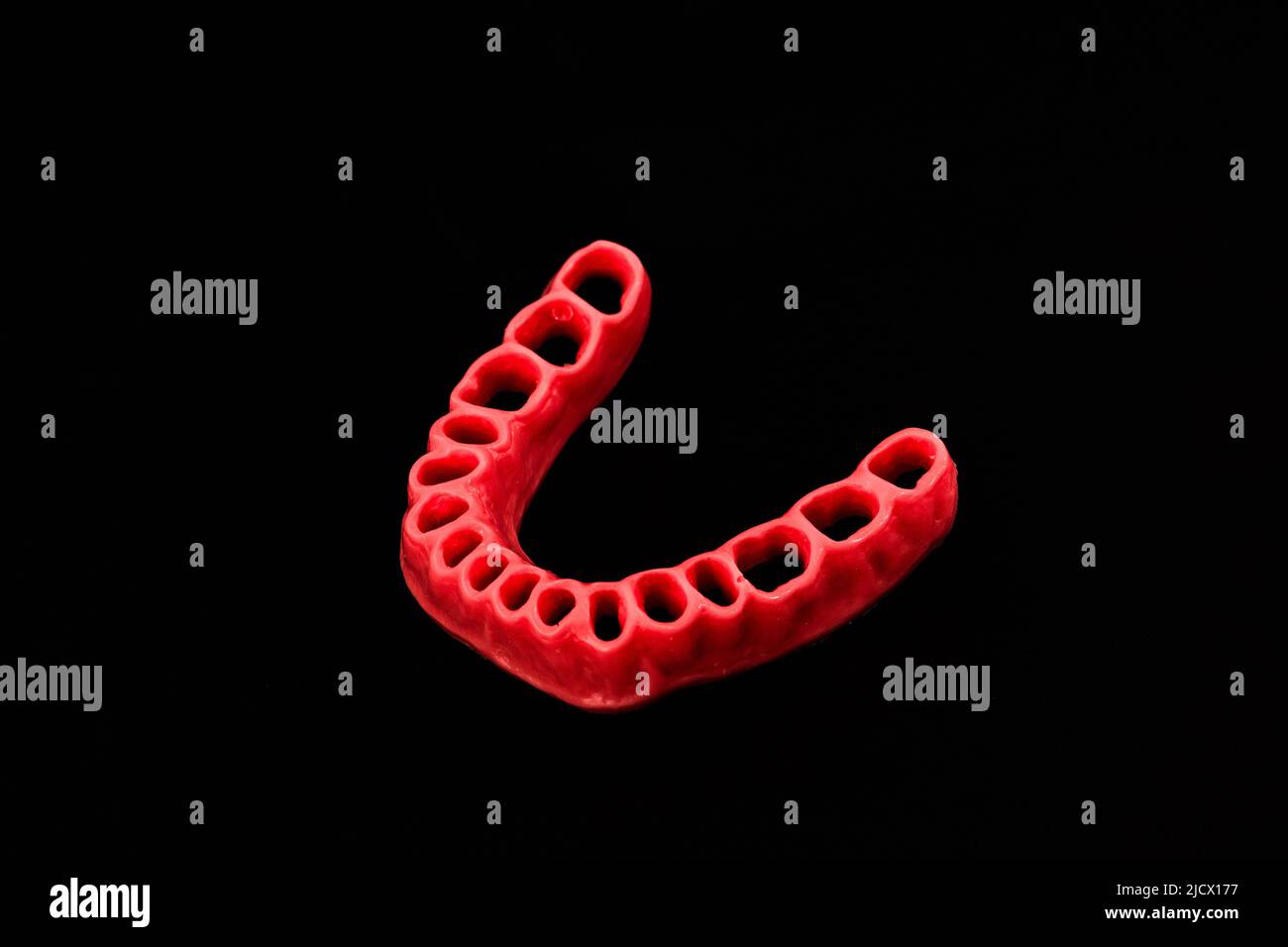 human gums without teeth model medical implant isolated on black ...