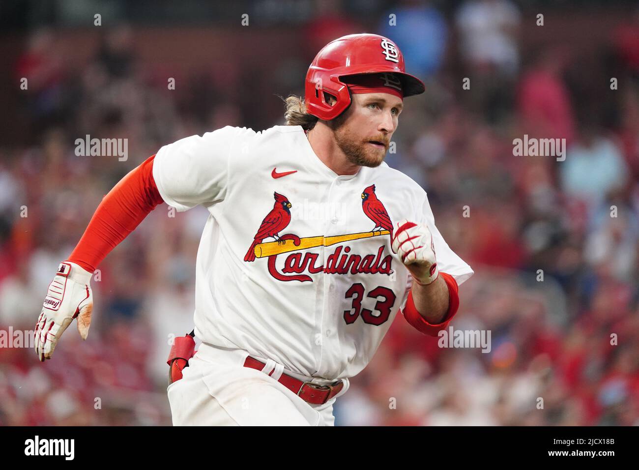 St. Louis Cardinals Brendan Donovan sprints toward first base, hitting ...