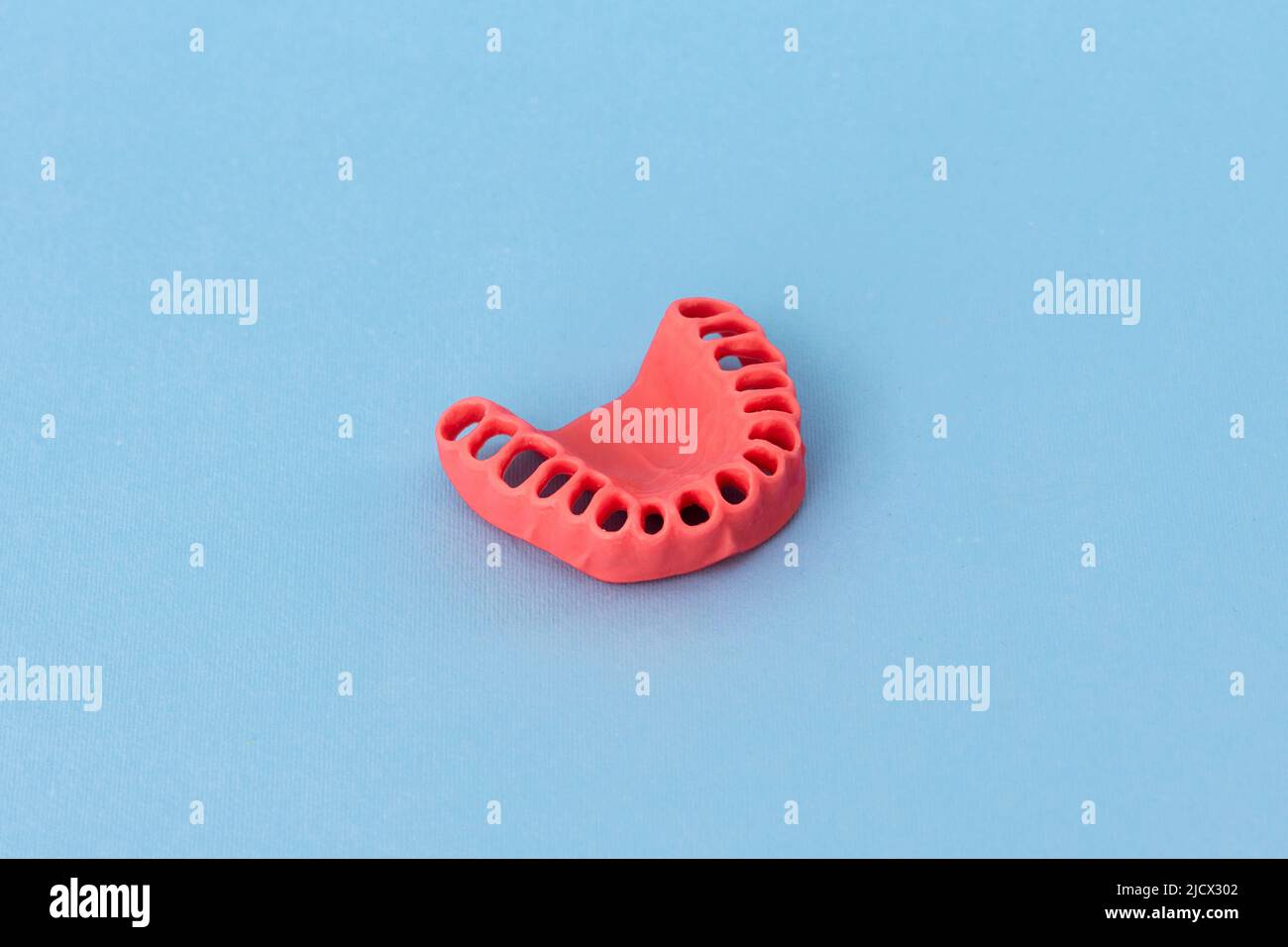 human gums without teeth model medical implant isolated on blue ...