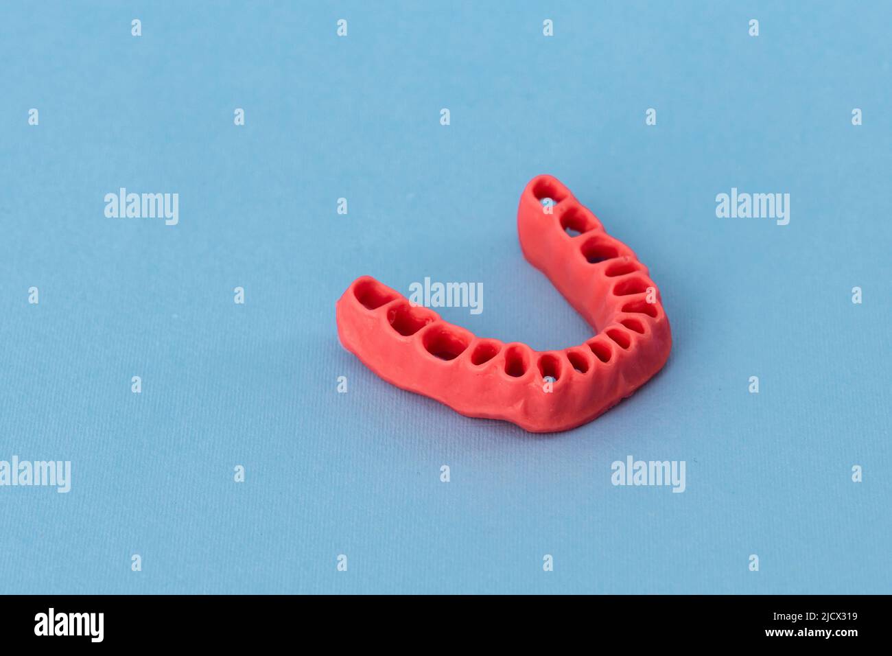 human gums without teeth model medical implant isolated on blue ...