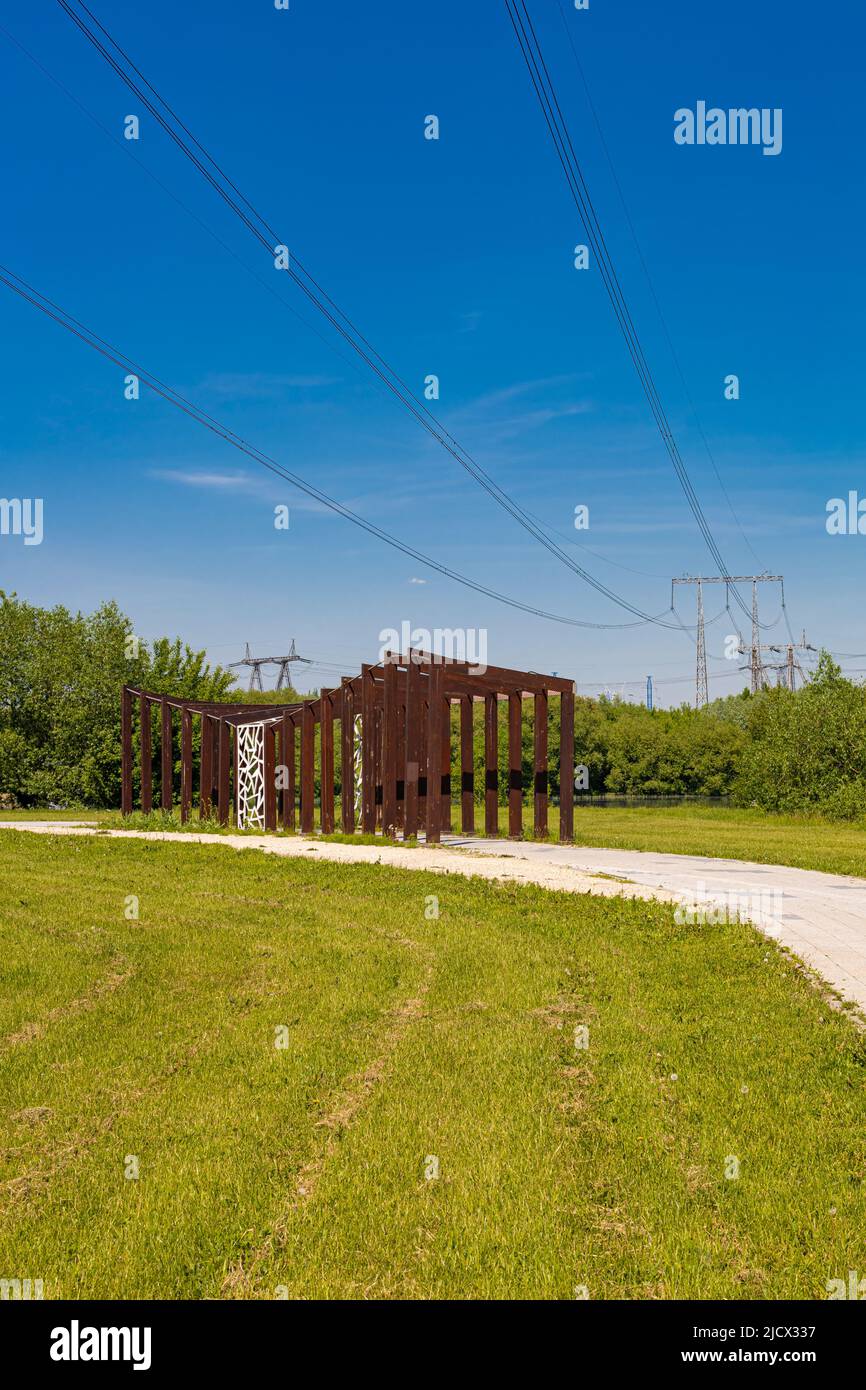 mast of power lines under which there is a wooden crossing. High ...
