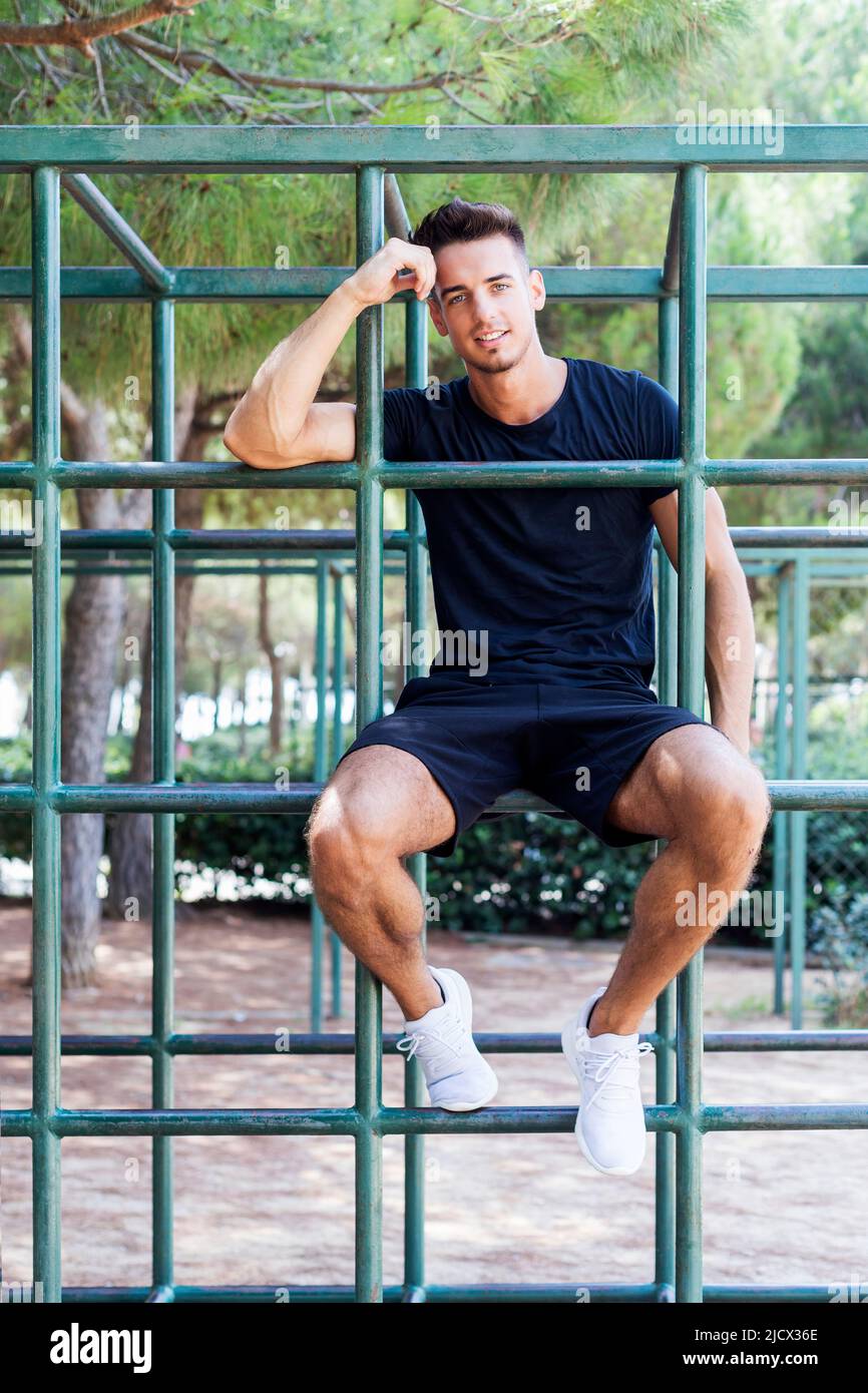 Portrait of a handsome young guy sportsman, wearing sports clothes ...