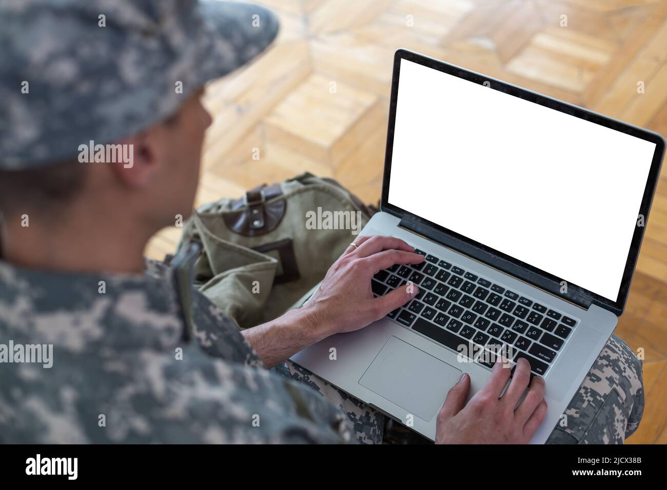 soldier in military uniform using high tech computer in headquarters ...