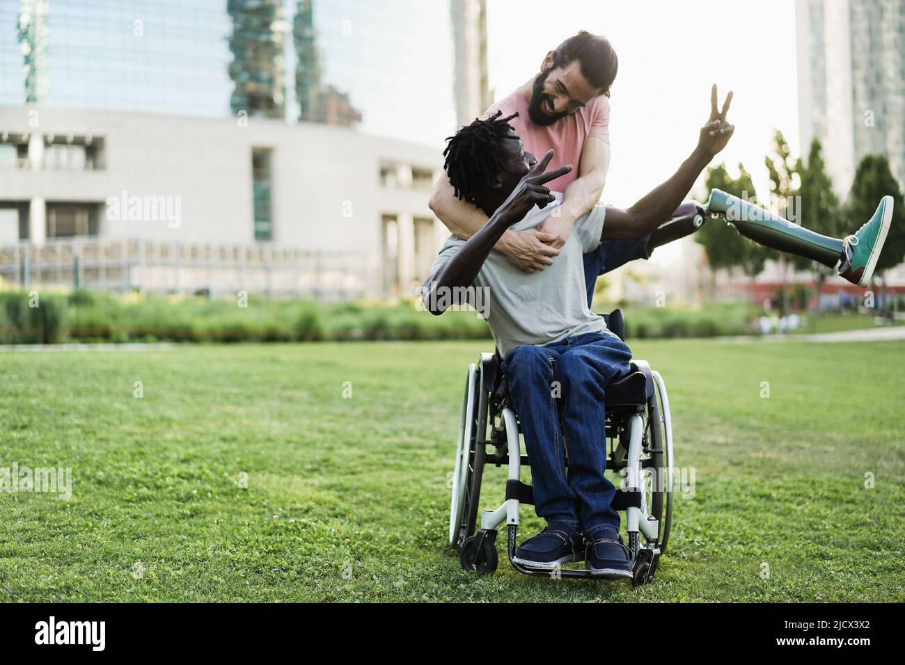 Happy friends with disability having fun at park city - Focus on ...