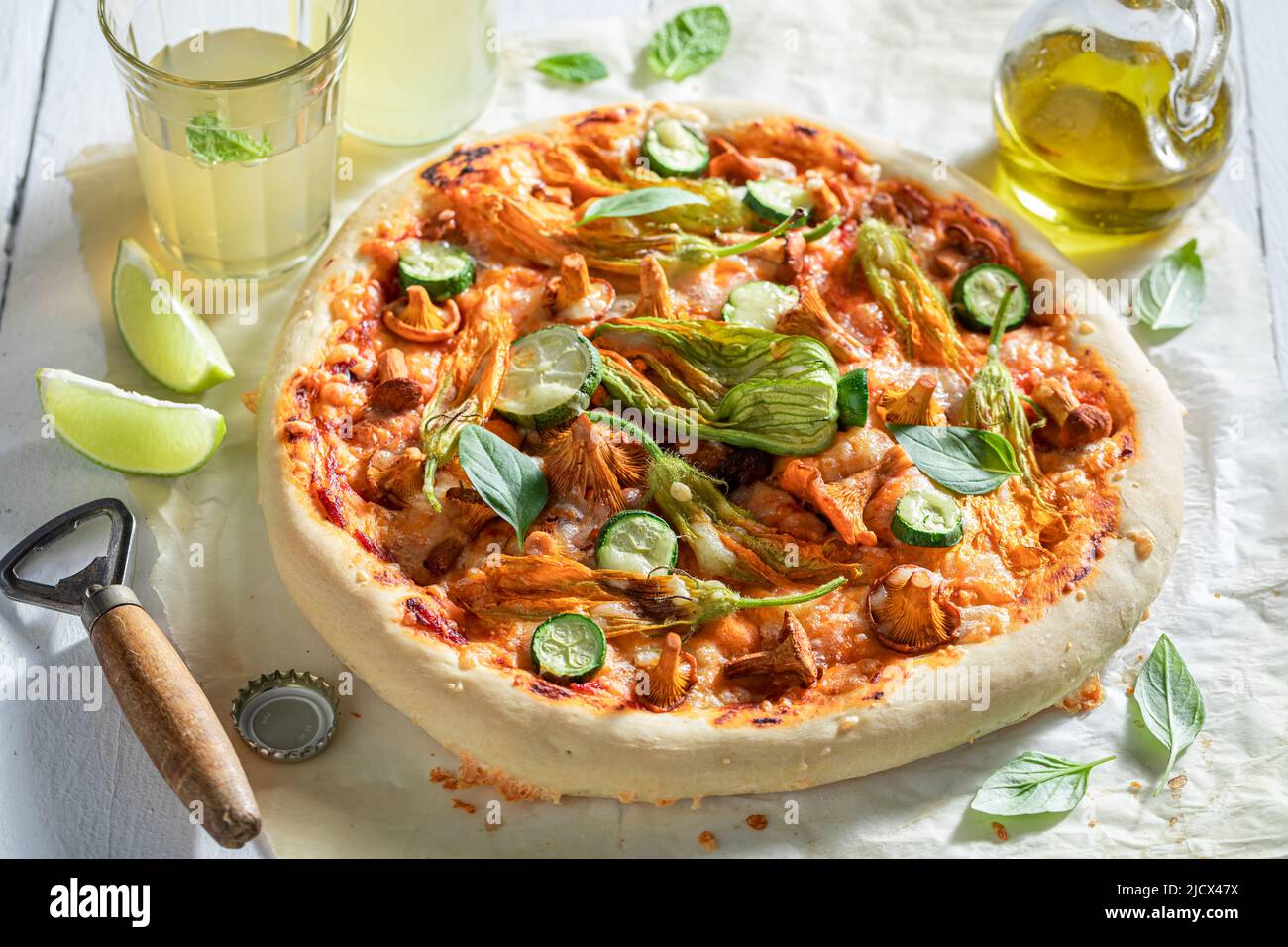 Hot and crunchy pizza served with cold lemonade made of zucchini flower ...