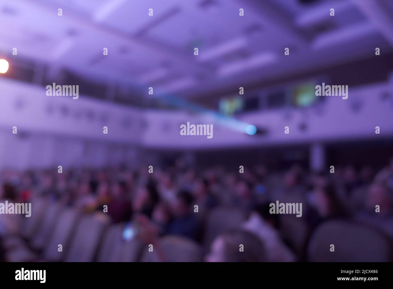 Event hall with chairs on a blurry background. The audience of a music ...