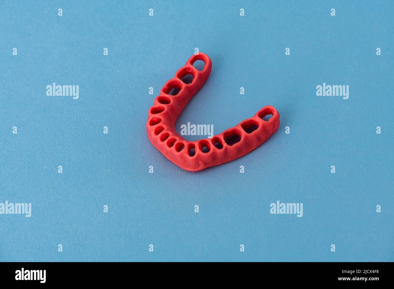 human gums without teeth model medical implant isolated on blue ...
