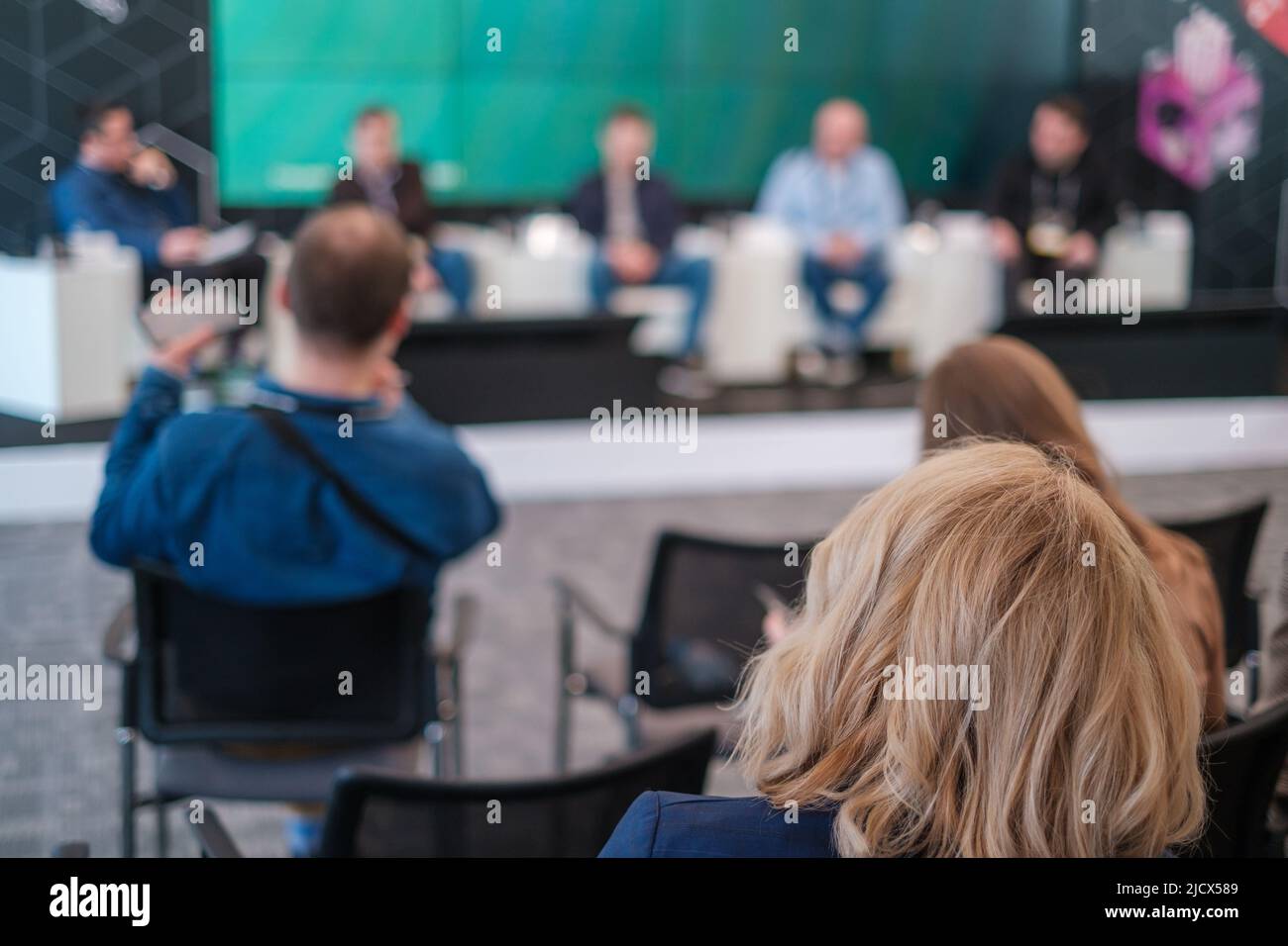 Business conference participants sitting in auditorium Stock Photo - Alamy
