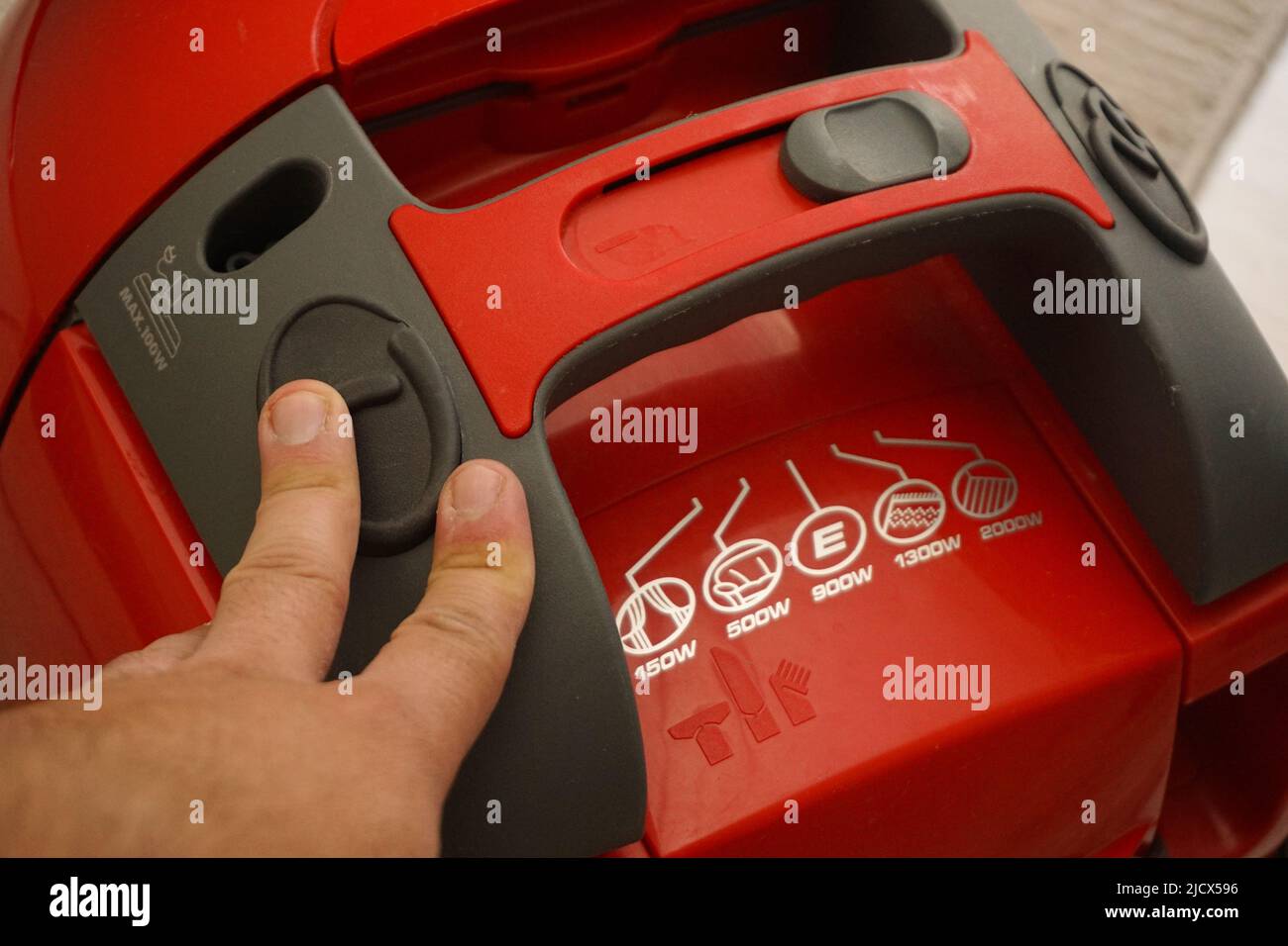Man pushing power button on vacuum cleaner close up view Stock Photo ...