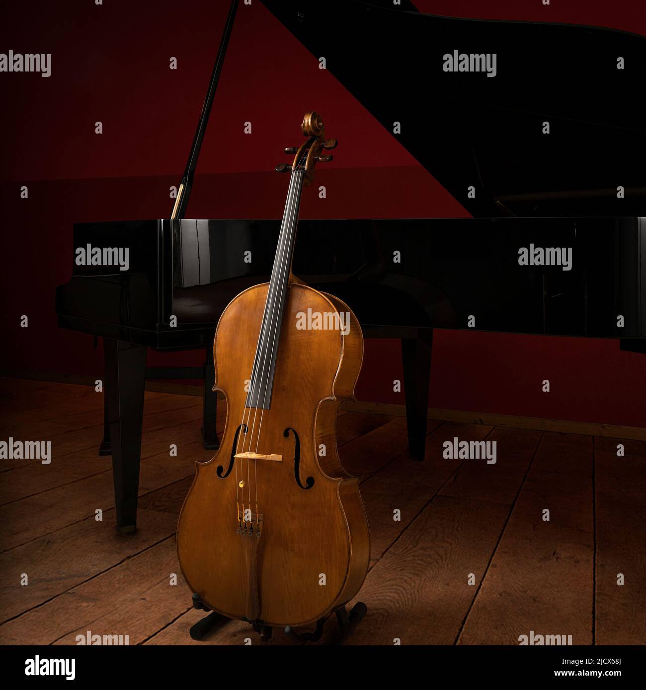 Two classical instruments - the cello and the grand piano - on a stage ...