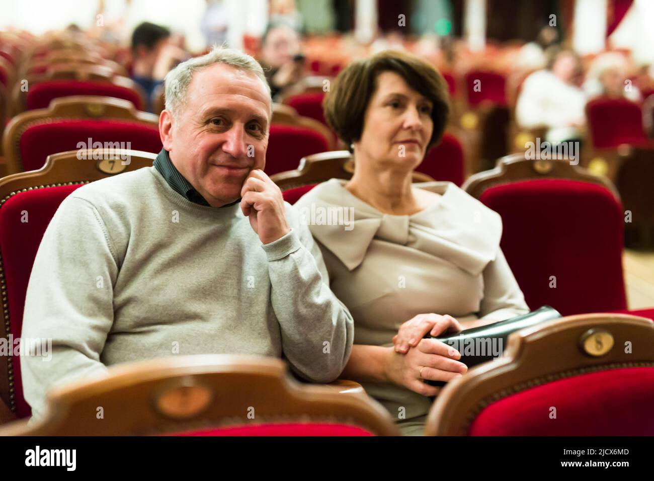 elderly couple watching play in the theater Stock Photo - Alamy