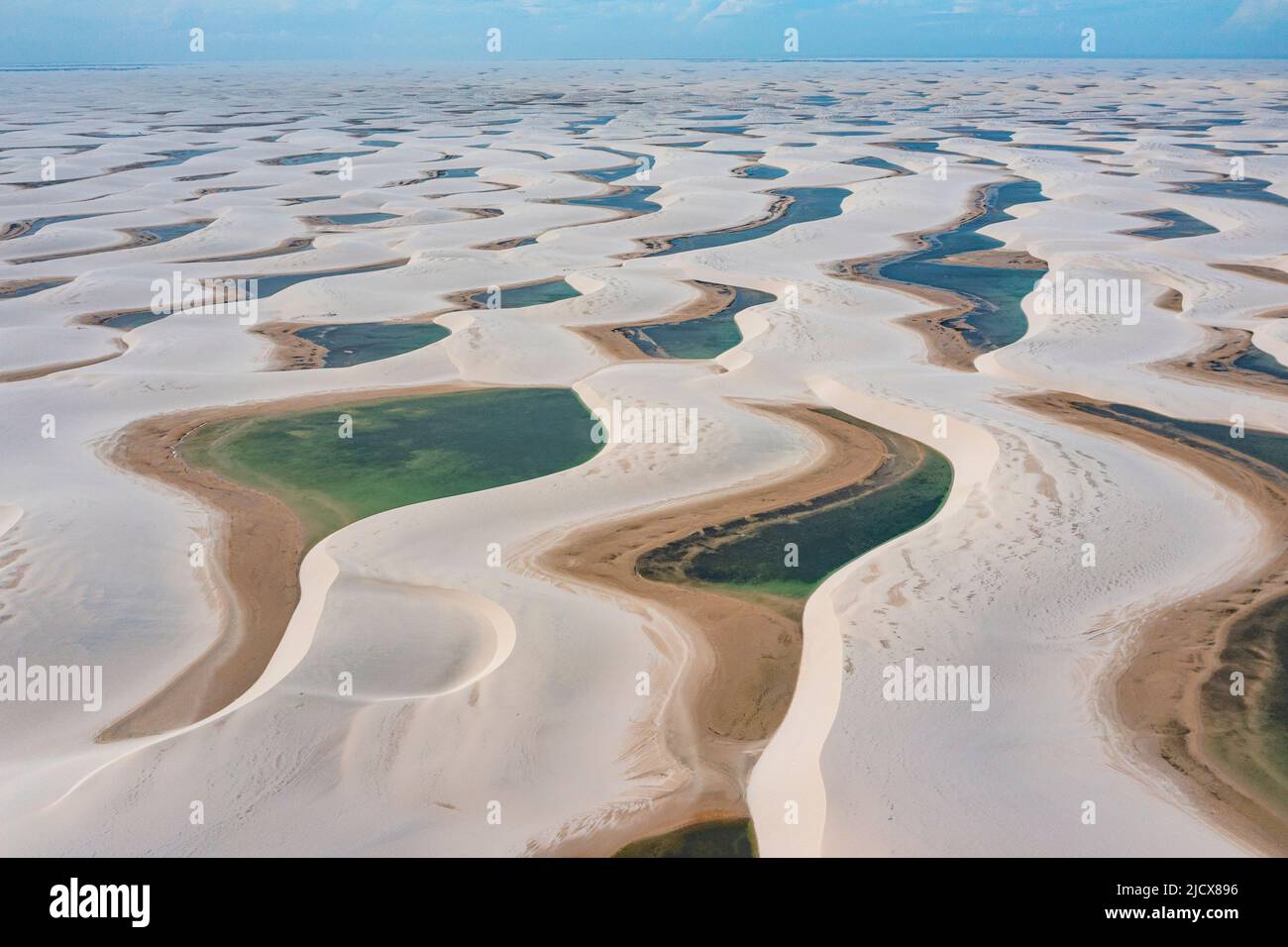 Aerial of freshwater lakes between huge sand dunes in the Lencois ...