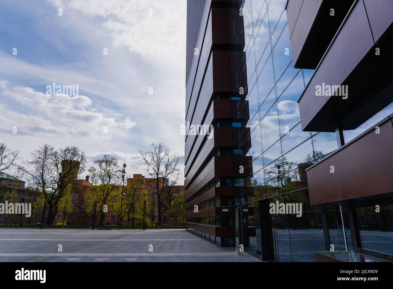 Modern building with glass facade on street in Wroclaw Stock Photo - Alamy