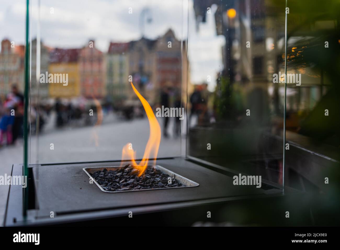 Close up view of fire in glass box on blurred street in Wroclaw Stock ...