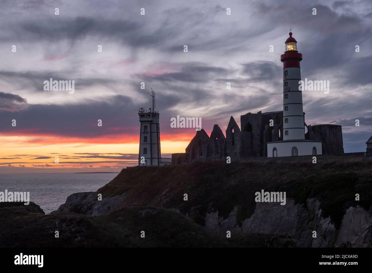Sunset at Saint Mathieu Lighthouse with ancient ruin below the ...