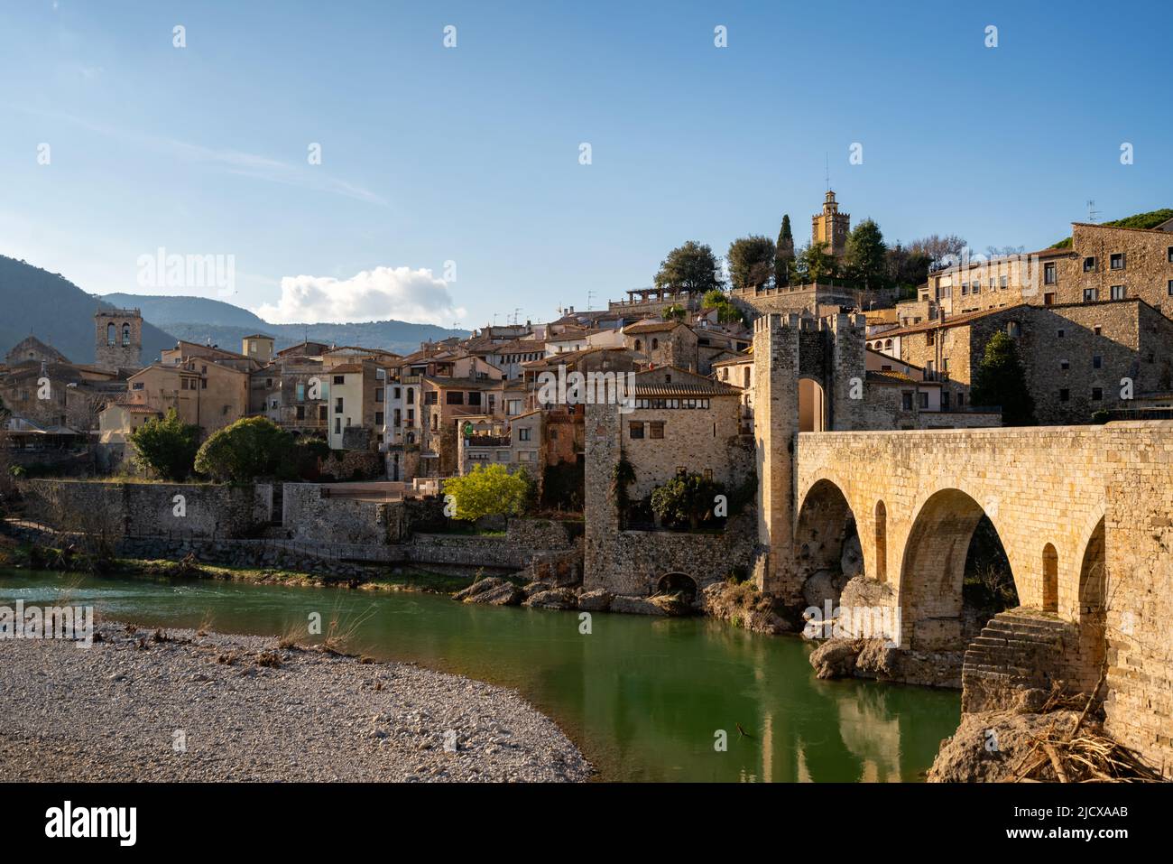 Besalu historic medieval city with Catalonia flags on the stone bridge ...