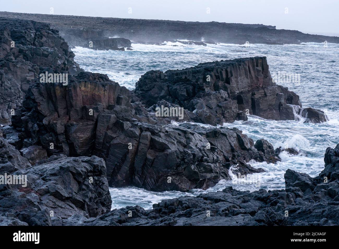 Storm waves hitting black basalt rock, Brimketill, Reykjanes peninsula ...