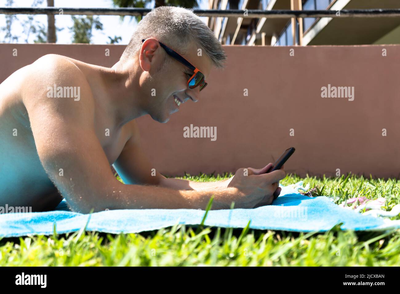 Man lying swimming pool hi-res stock photography and images - Alamy