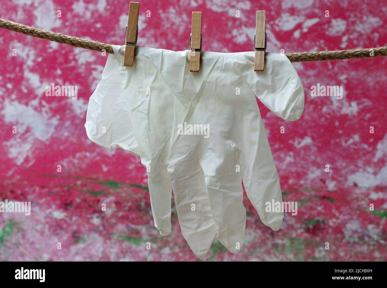 Surgical glove hanging on clothesline Stock Photo - Alamy Surgical glove hanging on clothesline Stock Photo - Alamy