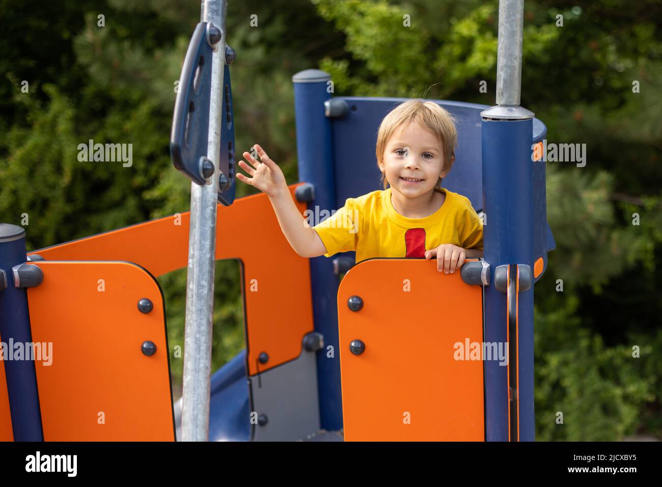 Cute child, playing on the playground, boy playing summertime Stock ...